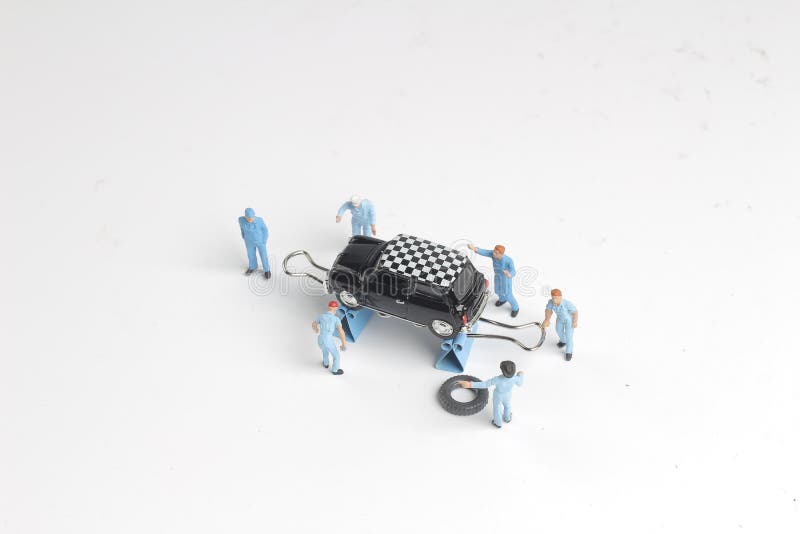 Mini Figure Mechanics Working on a Car Stock Photo - Image of house ...