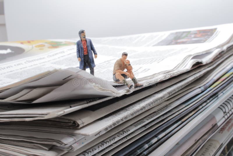 A Mini of the Figure on the Newspaper Stock Photo - Image of together ...
