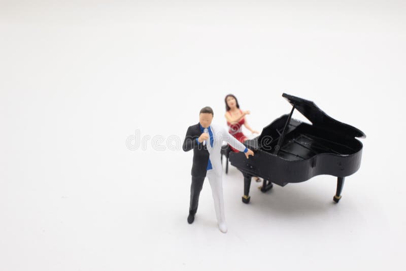 A Mini Figure Play Mini Piano with the Singer Stock Image - Image of ...