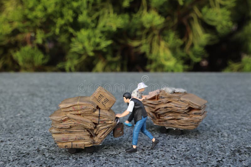 Mini Figure Pushes a Trolley Laden with Bags through Stock Photo ...