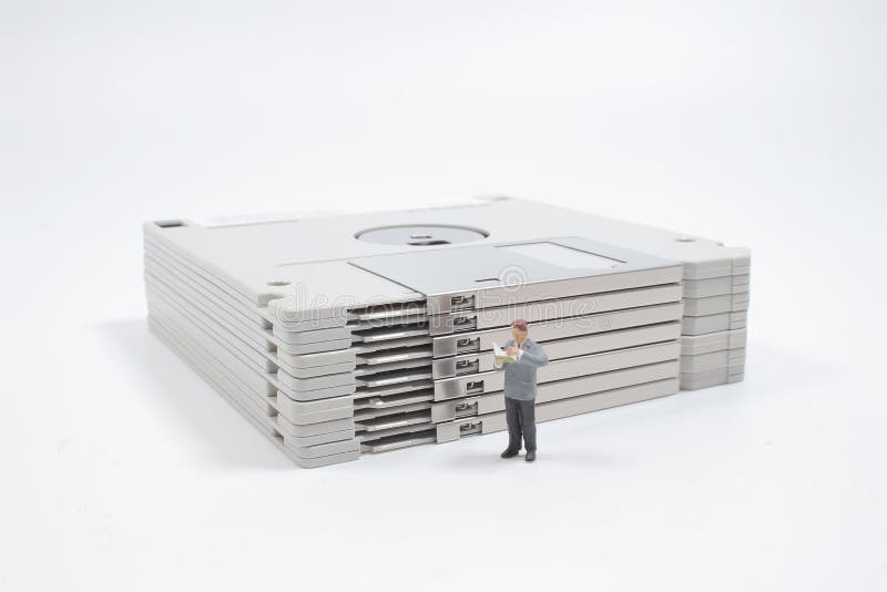 A Mini of Figure Reading with the Floppy Disk Stock Photo - Image of ...
