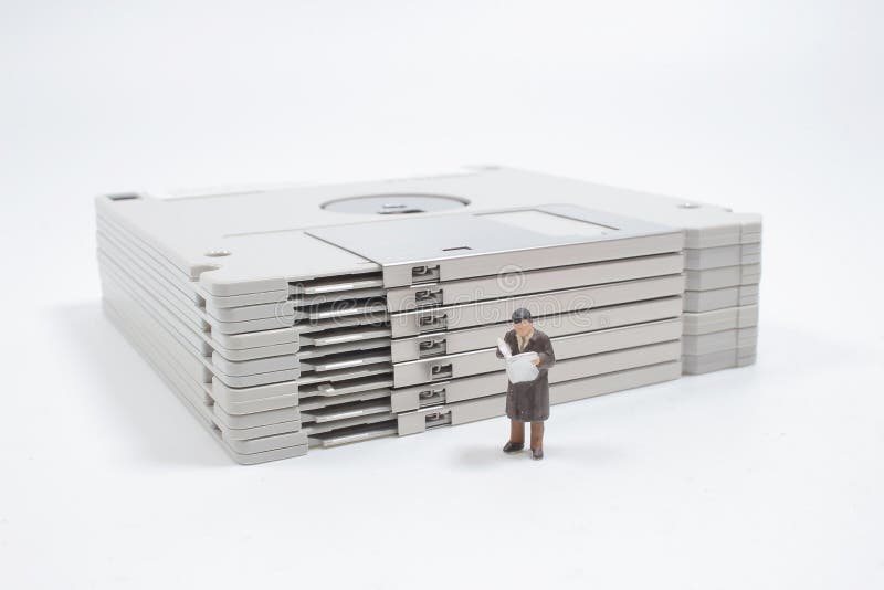 A Mini of Figure Reading with the Floppy Disk Stock Image - Image of ...