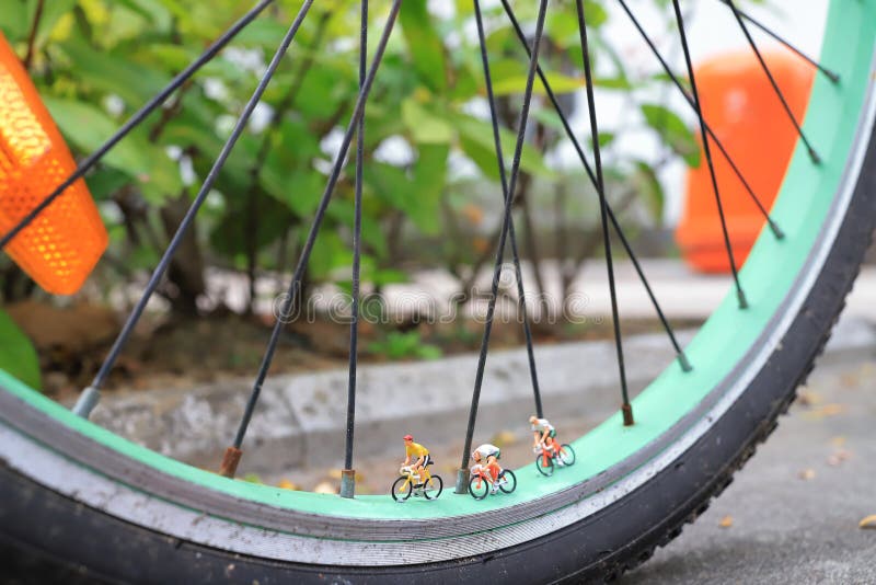 A Mini of Figure Ride the Bike on Bike Stock Photo - Image of globe ...