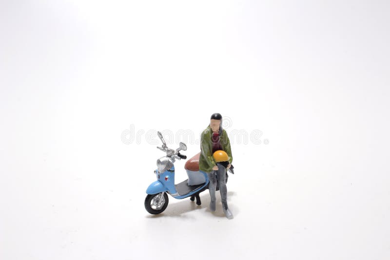 A Mini of Figure Standing Near Futuristic Motorcycle Stock Photo ...