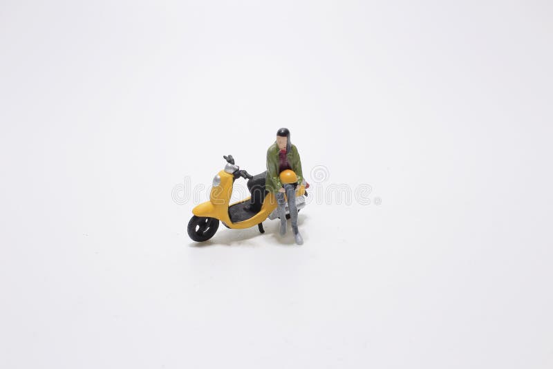 A Mini of Figure Standing Near Futuristic Motorcycle Stock Photo ...