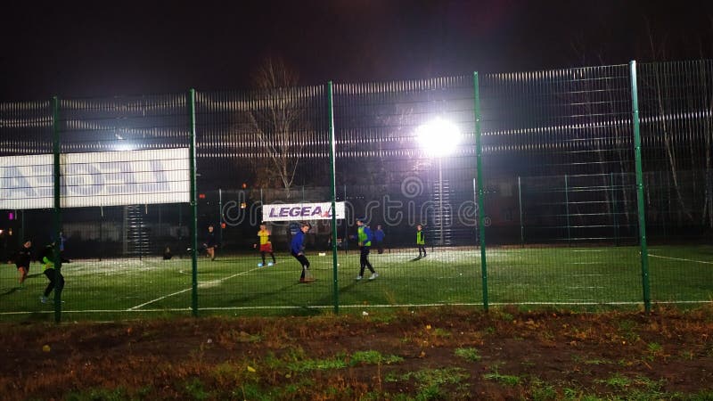 Mini football evening game editorial photography. Image of light ...