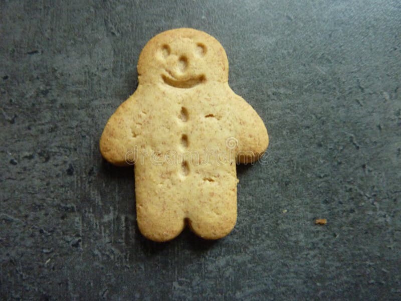 Mini Gingerbread Man Sitting on a Kitchen Worktop Stock Photo - Image ...