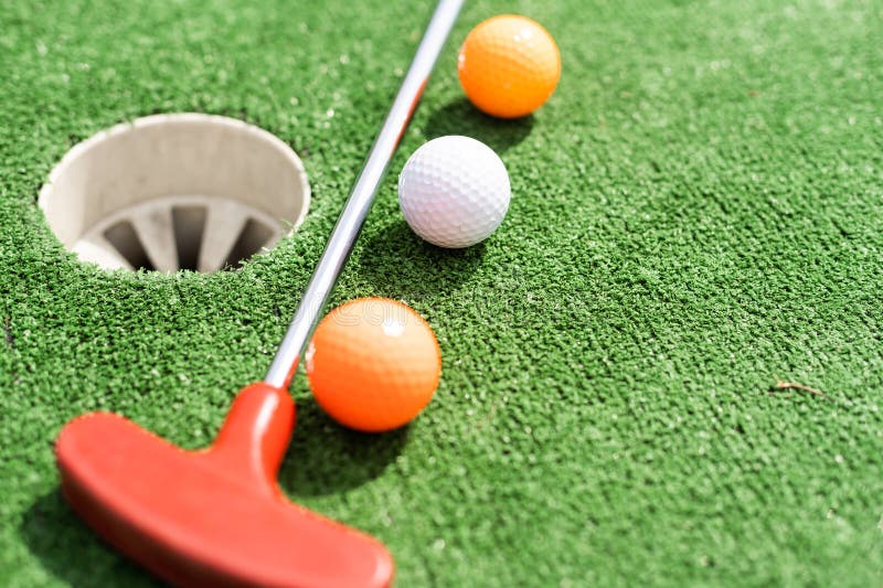 Mini Golf Ball on Green Headed Towards Hole Stock Image - Image of ...