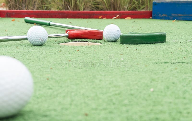 Mini Golf. a Club and a White Ball on a Golf Course. Stock Image ...