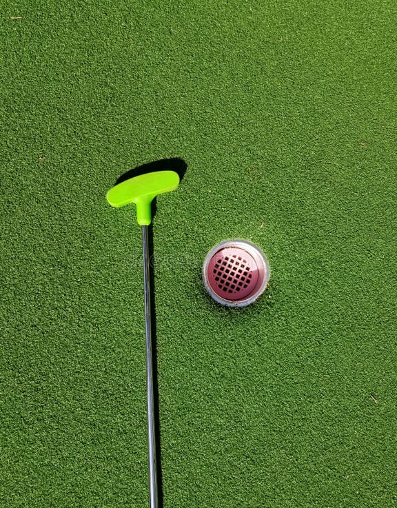 Mini Golf Putter and Hole on Green Artificial Turf Grass Stock Image ...