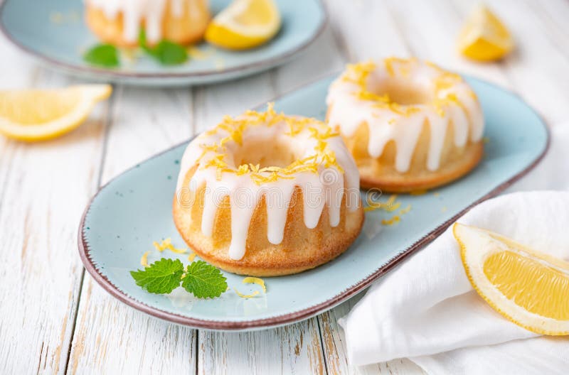 Mini Lemon Bundt Cakes Topped with Lemon Glaze Stock Photo - Image of ...