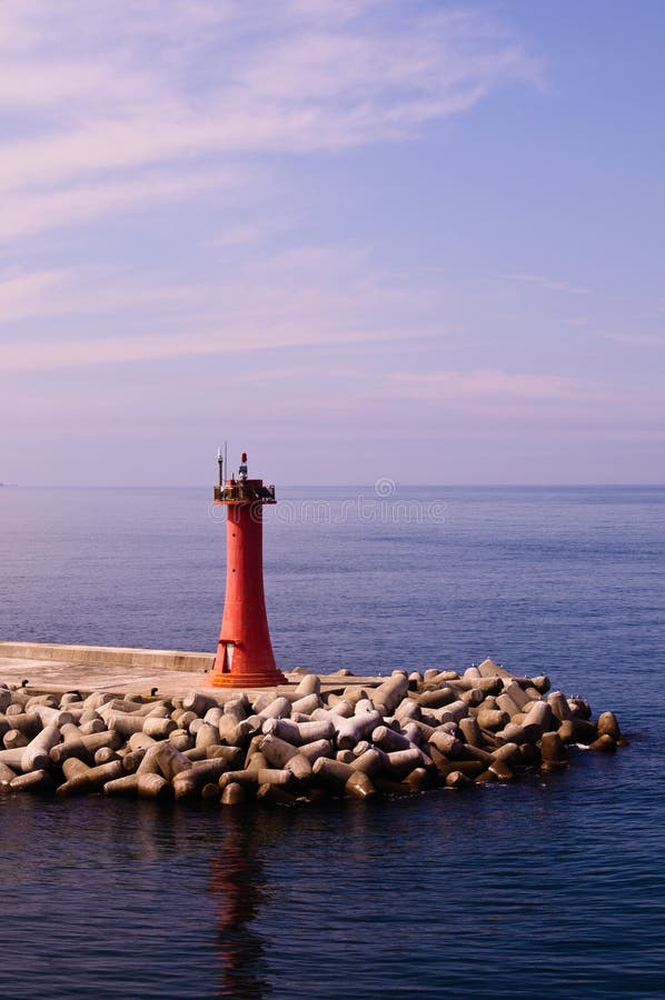 Mini Lighthouse on the Coast. Small Red Lighthouse on the Pier Stock ...