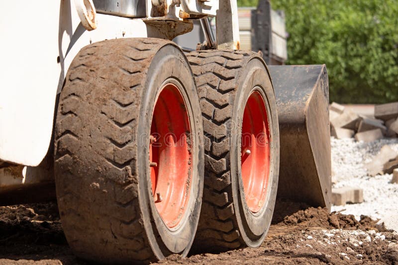 Mini Loader on Wheels during Heavy Earthworks Stock Image - Image of ...