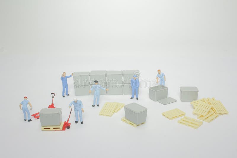 Mini Man Worker Figure Using a Trolley Stock Photo - Image of miniature ...