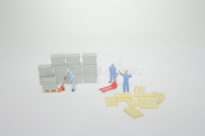 Mini Man Worker Figure Using a Trolley Stock Image - Image of loading ...