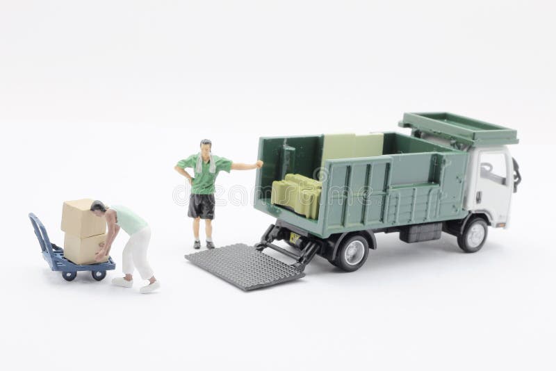 Mini Man Worker Figure Using a Trolley Stock Photo - Image of loading ...