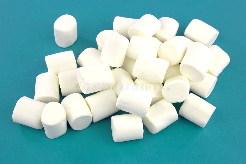 Mini Marshmallows on a Blue Background. Geometric Pattern of White ...