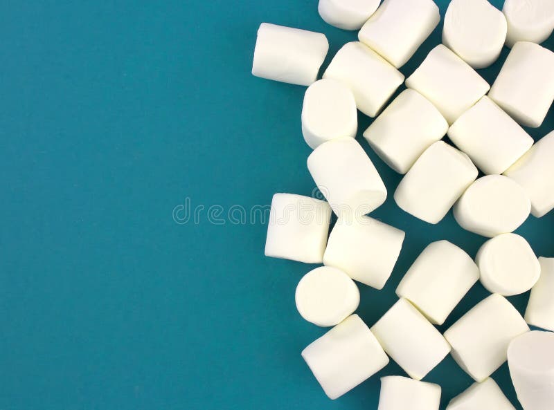 Mini Marshmallows on a Blue Background. Geometric Pattern of White ...