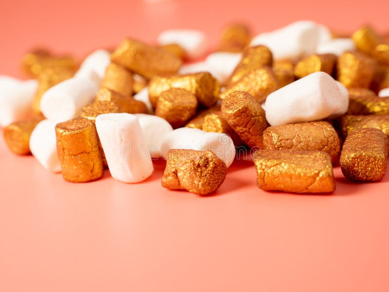 Mini Marshmallows on a Pink Background. Marshmallow Gold and White ...