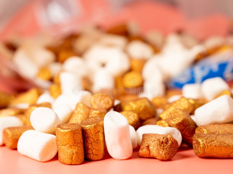 Mini Marshmallows on a Pink Background. Marshmallow Gold and White ...