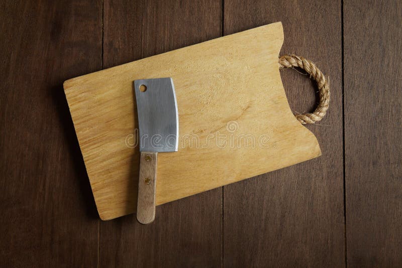 A Mini Meat Cleaver Knife on Wooden Cutting Board with Ropes Stock ...