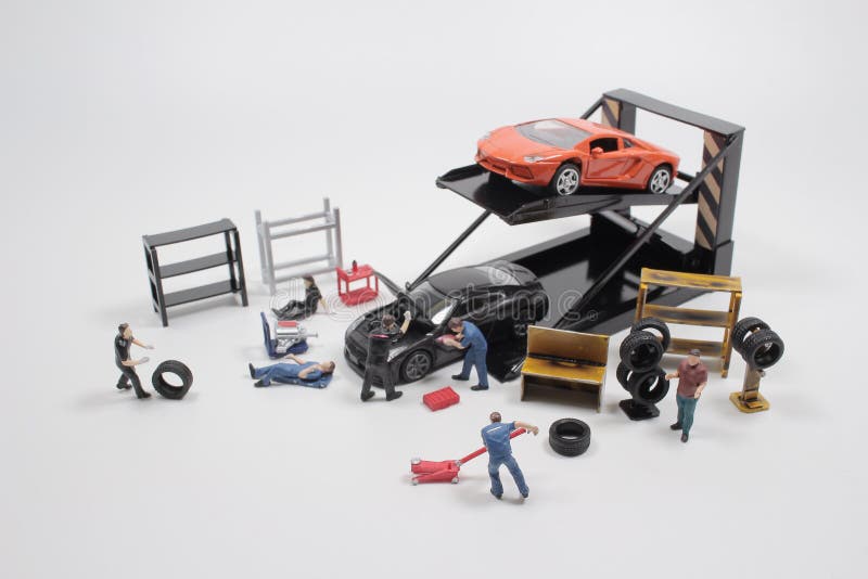 A Mini Mechanics Repairing Toy Car,concept of the Workshop Stock Image ...