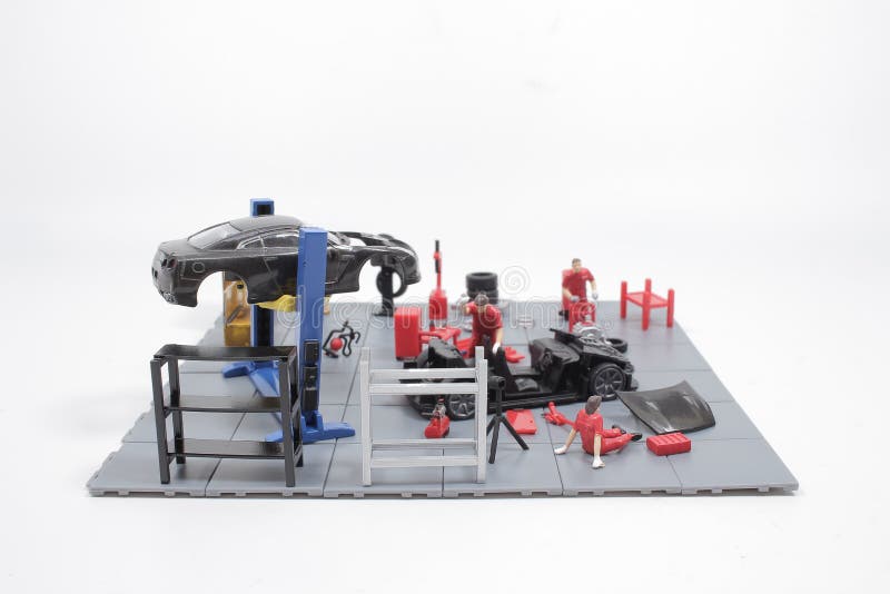 A Mini Mechanics Repairing Toy Car,concept of the Workshop Stock Image ...