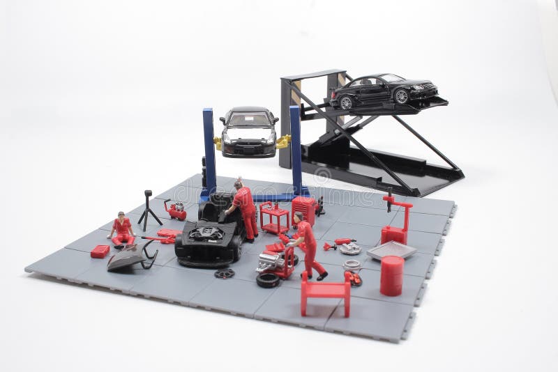 A Mini Mechanics Repairing Toy Car,concept of the Workshop Stock Image ...