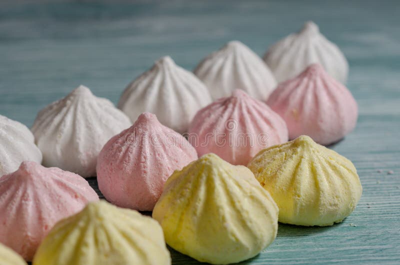 Mini Meringues of Pastel Colors on Light Blue Background Stock Photo ...