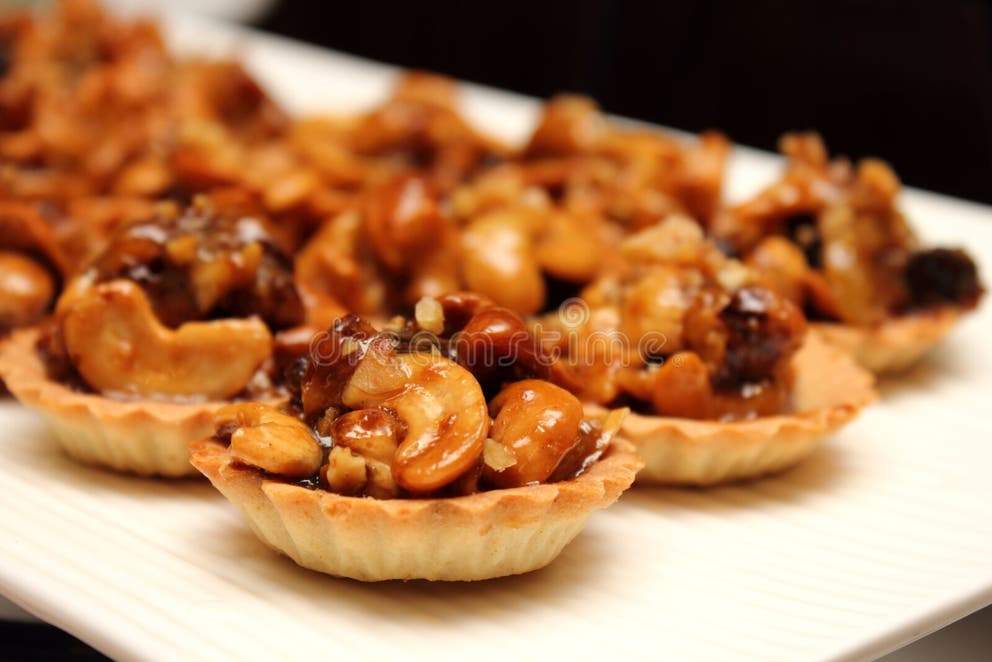 Mini Mixed Nuts Pie on White Stock Photo - Image of food, pastry: 39896818