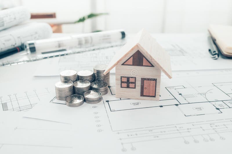 Mini Model House and Money Coin on Blueprint House Plan Design. Cost ...