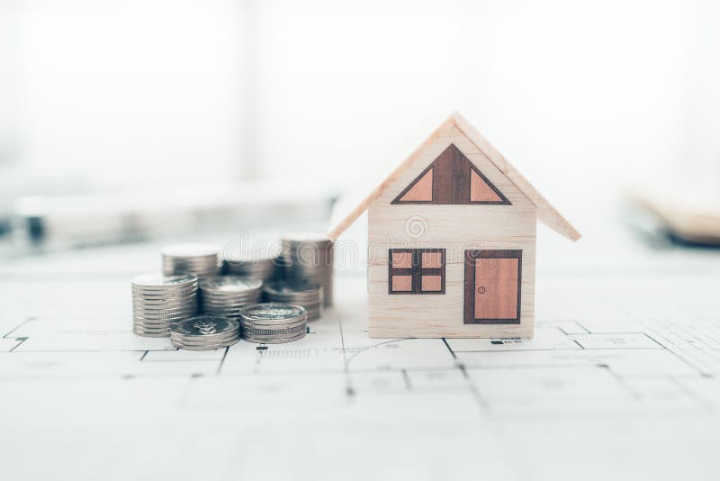 Mini Model House and Money Coin on Blueprint House Plan Design. Cost ...