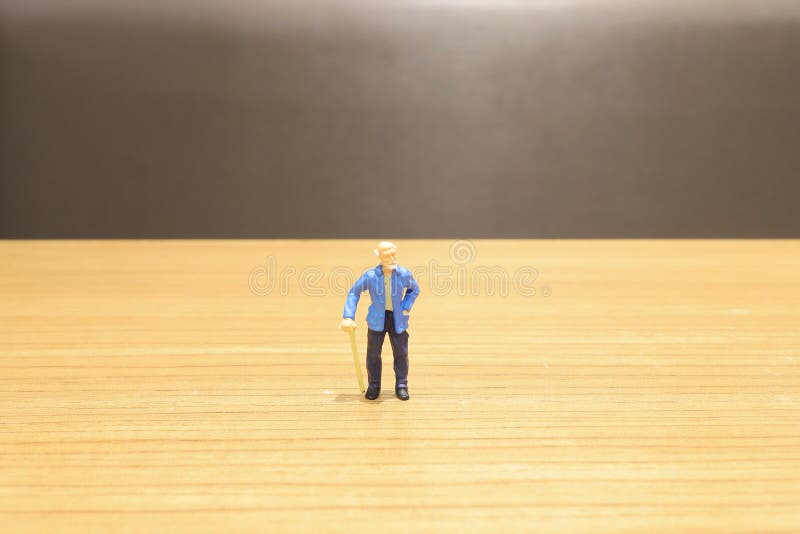 A Mini of Old Man Figure on Board Stock Photo - Image of beard, tunic ...