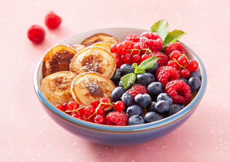Mini Pancake Breakfast Bowl with Berries and Maple Syrup Stock Photo ...