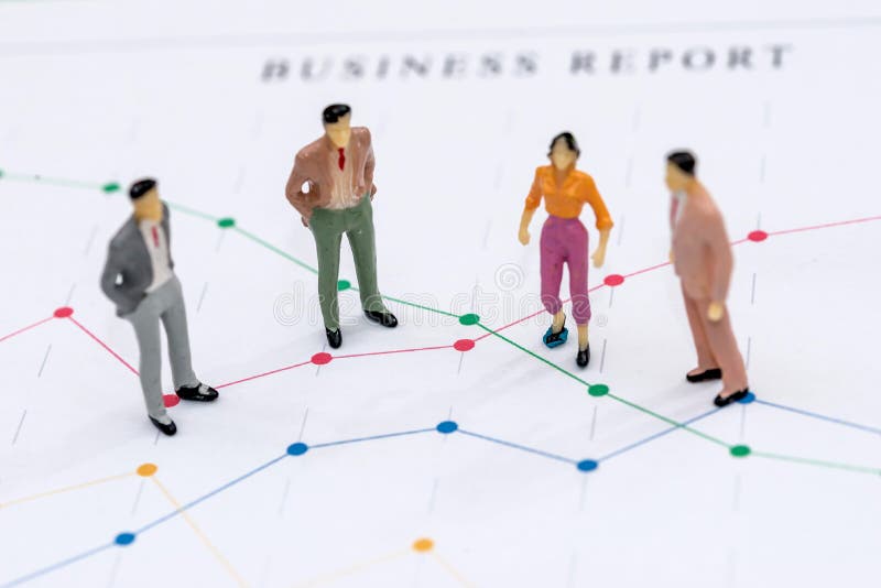 Mini People Figures Standing on Business Graphs Stock Image - Image of ...