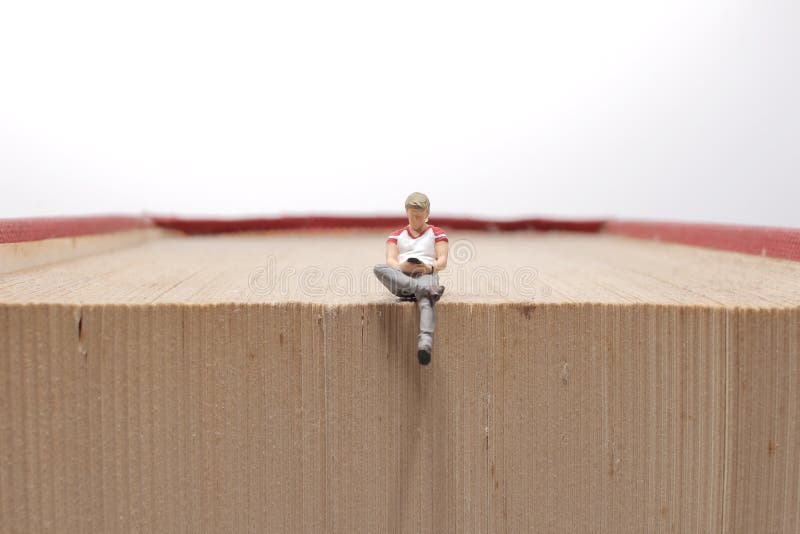 A Mini People Reading with Book, Education or Business Concept Stock ...