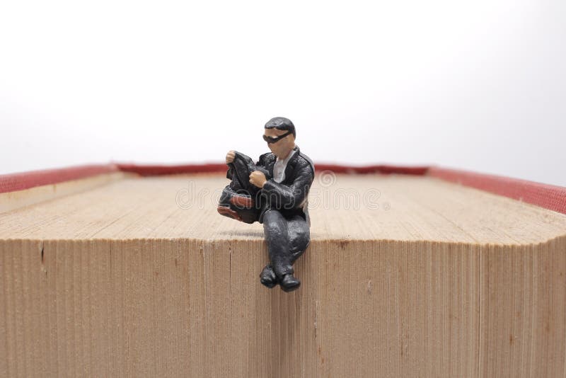 A Mini People Reading with Book, Education or Business Concept Stock ...