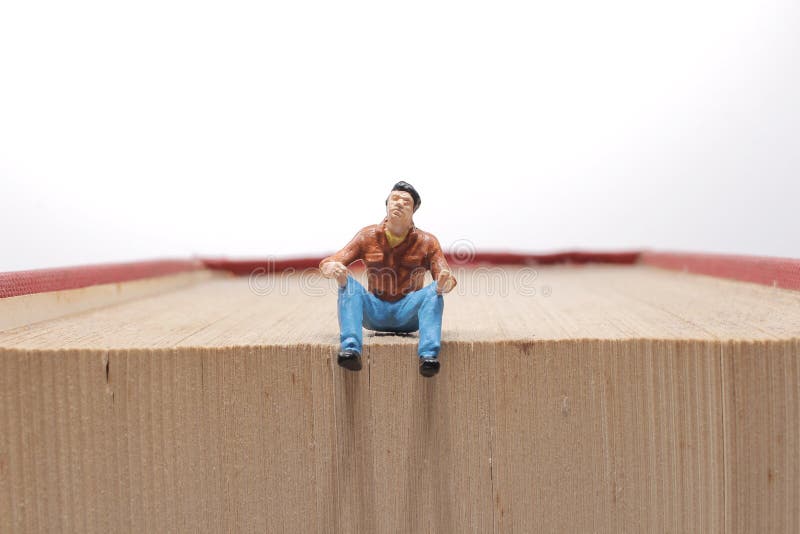 A Mini People Reading with Book, Education or Business Concept Stock ...