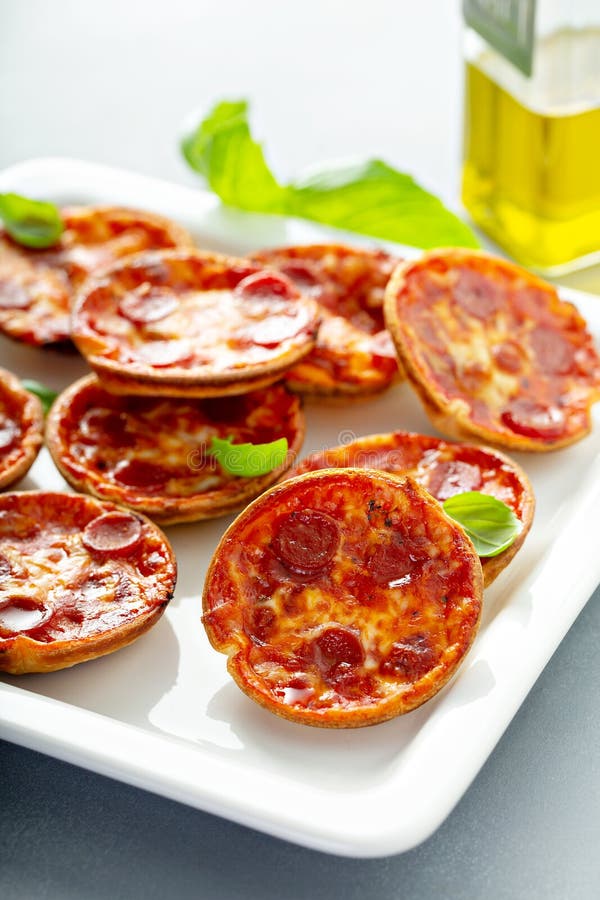 Mini pepperoni pizzas stock photo. Image of cuisine - 141665606