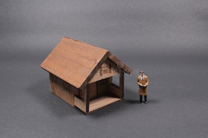 A Mini of Person Figure with House Stock Photo - Image of business ...