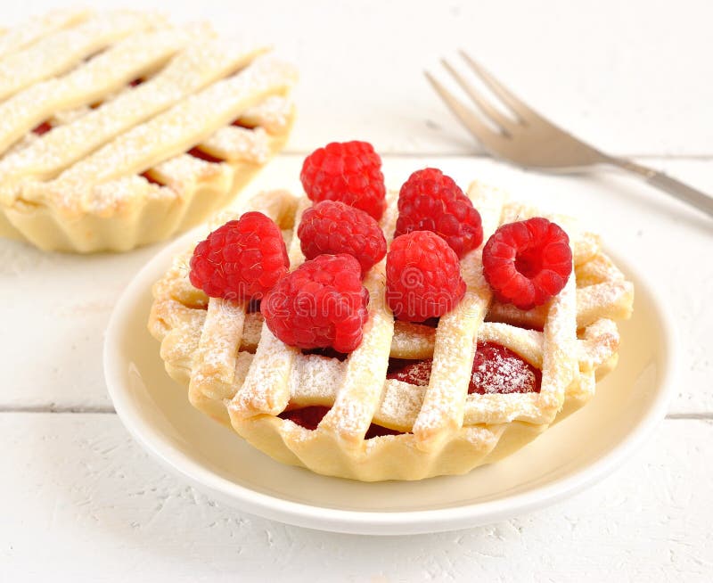 Mini pie with raspberry stock image. Image of portion - 25287933