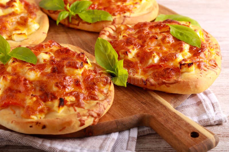Mini Pizzas with Mixed Cheese Stock Photo - Image of mini, bakery ...