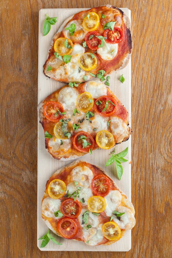 Mini pizzas stock image. Image of green, cuisine, melted - 39129237