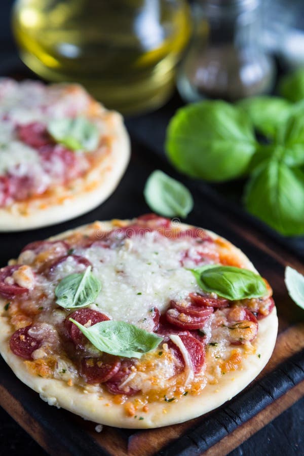 Mini Pizzas with Pepperoni and Cheese Stock Photo - Image of party ...