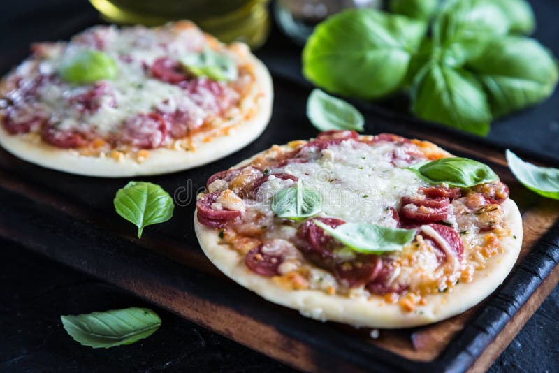Mini Pizzas with Pepperoni and Cheese Stock Photo - Image of party ...