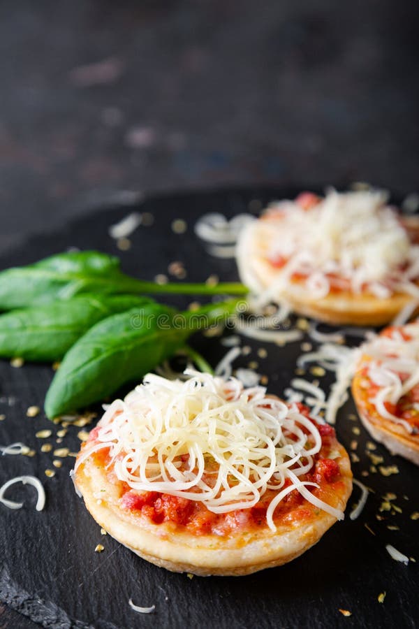 Mini Pizzas with Pepperoni and Cheese Stock Photo - Image of party ...