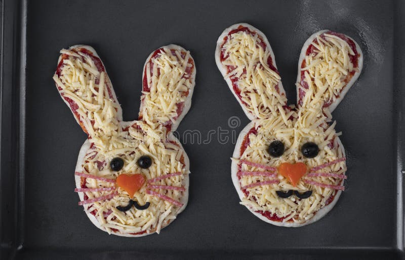 Mini Pizzas in the Shape of a Rabbit before Baking on Baking Sheet ...
