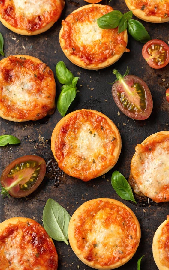 Mini Pizzas with Tomatoes and Mozzarella Cheese Stock Photo - Image of ...