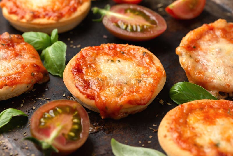 Mini Pizzas with Tomatoes and Mozzarella Cheese Stock Photo - Image of ...
