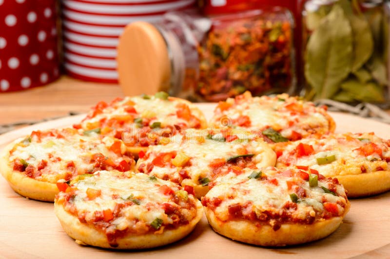 Mini Pizzas on Baking Tray stock photo. Image of pizzas - 138258340